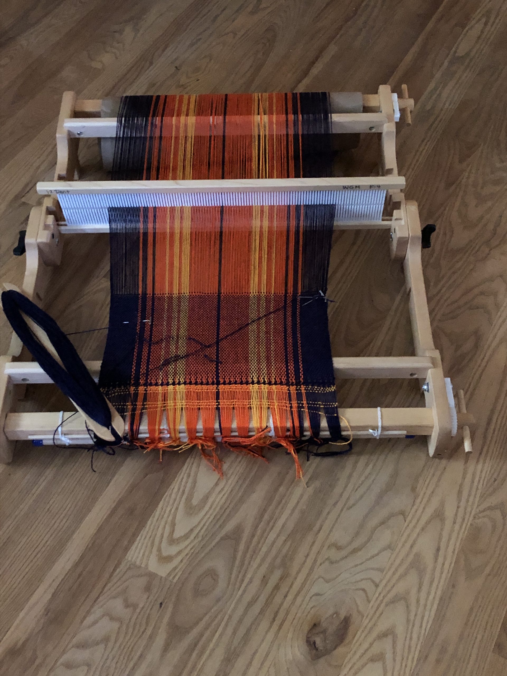 Weaving on a Loom – A Stone in the River
