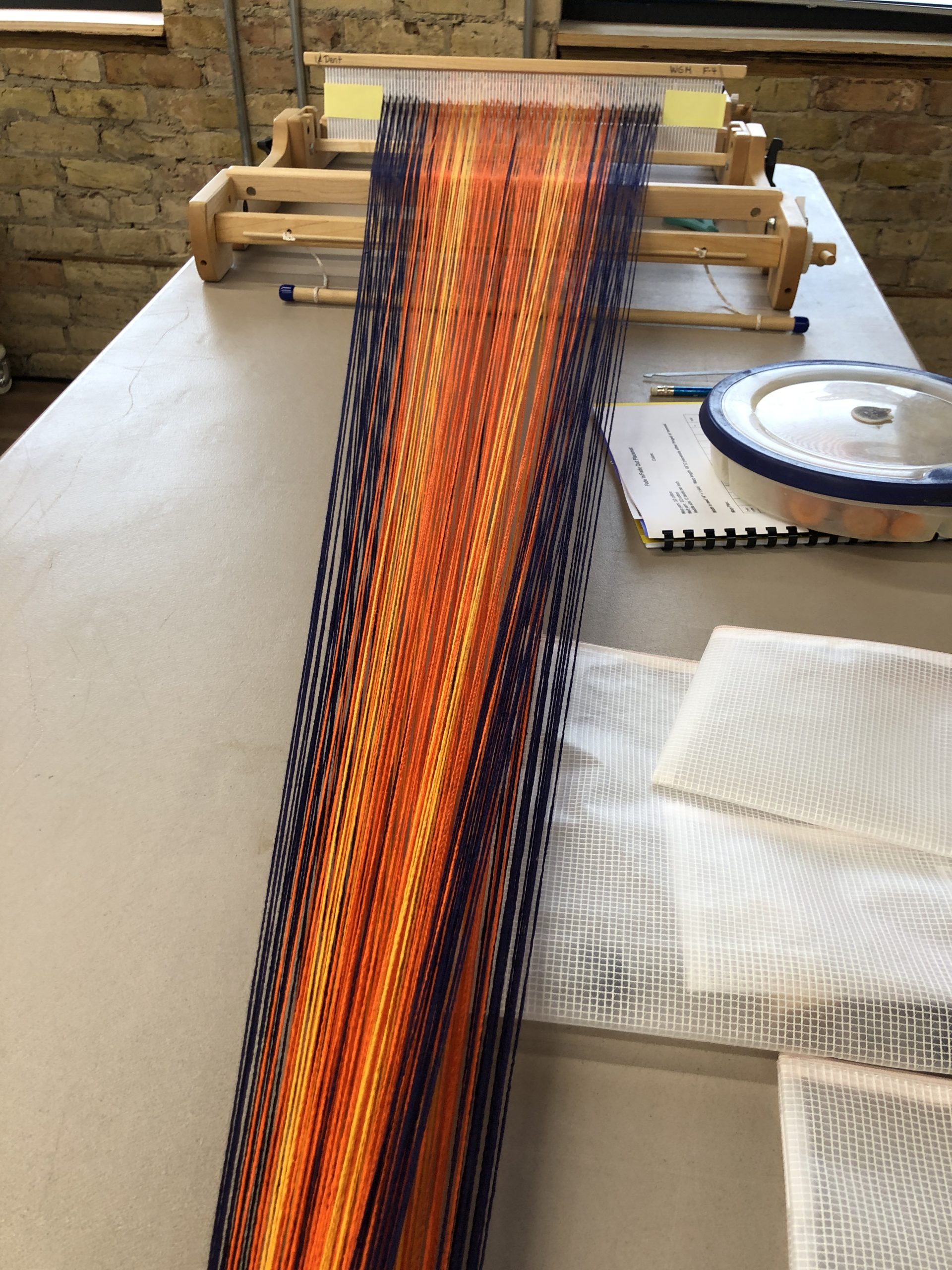 Weaving on a Loom – A Stone in the River